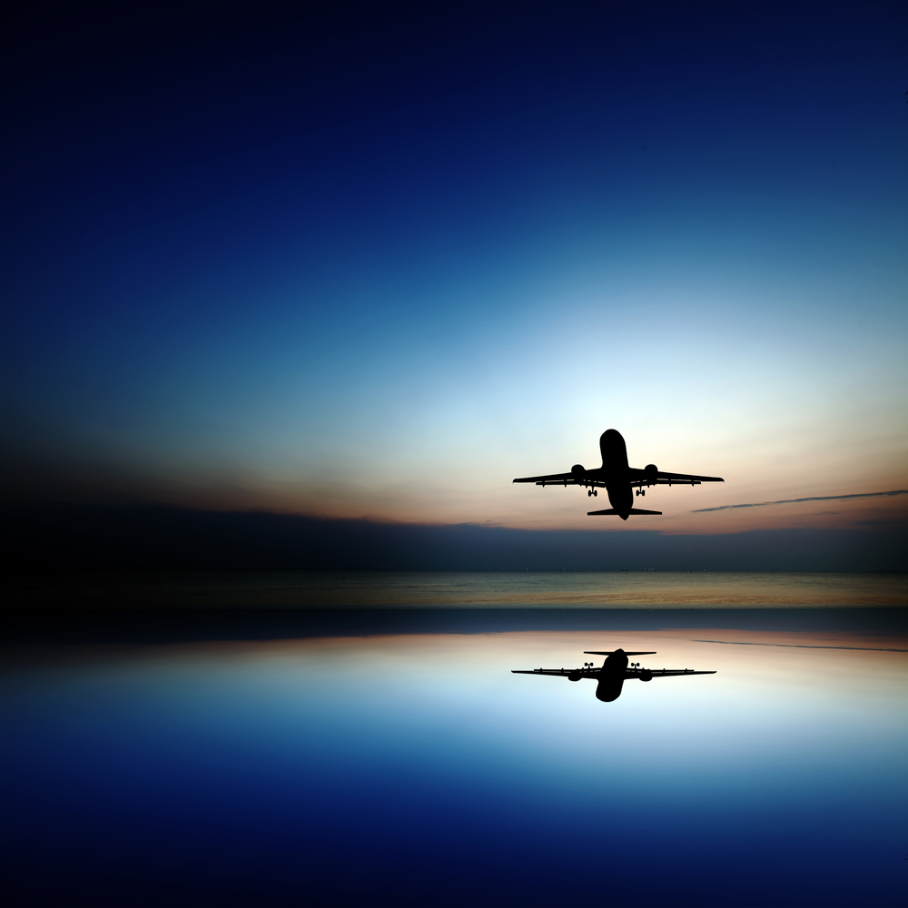 shutterstock airplane in mid air | SUPERADRIANME.com